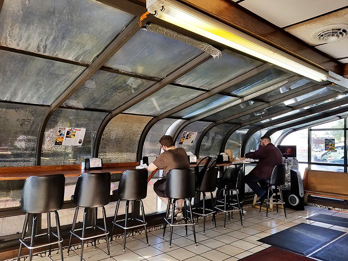 Counter seating that invites you to watch the burger magic happen. It's dinner and a show, minus the expensive tickets.
