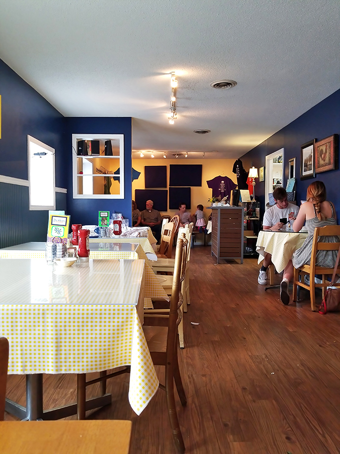Blue walls, yellow tables, wooden floors - the diner trifecta where comfort food meets comfort seating.