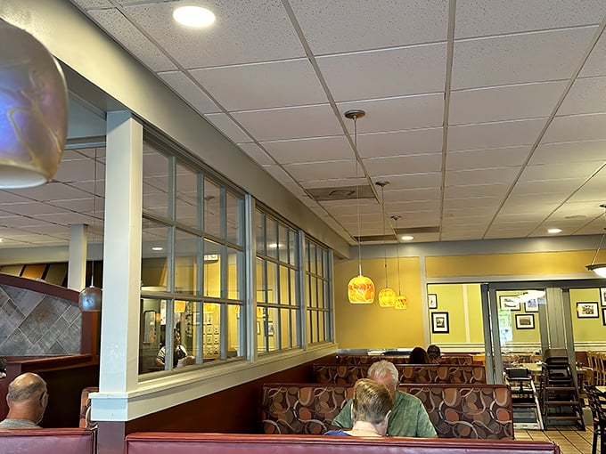 The diner's open kitchen design isn't just practical—it's dinner theater where the sizzle of the grill provides the soundtrack to your meal.