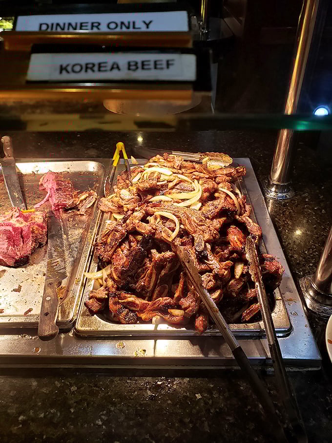 Korean beef, glistening with sweet and savory marinade, waits patiently beside its raw counterpart – a before-and-after story told in protein.