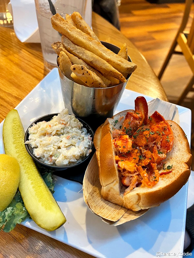 The lobster roll arrives like a celebrity—perfectly dressed, ready for its close-up, and guaranteed to make everyone at neighboring tables jealous.