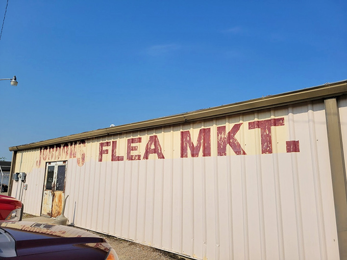 Faded letters on weathered siding hint at Poplar Bluff's market heritage, where locals have gathered for generations to trade goods.