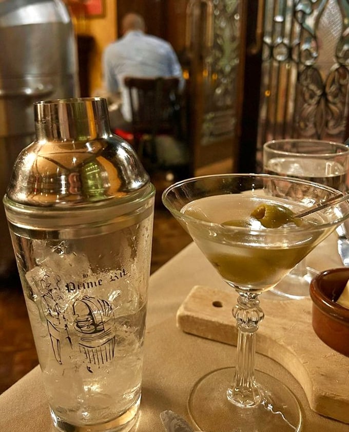 A properly made martini served alongside the shaker—because sometimes one serving just isn't enough after a long day in the city.