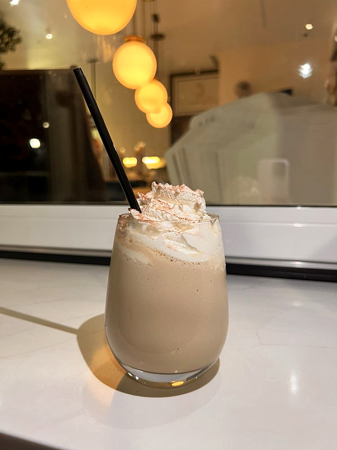 This isn't just a milkshake—it's a frothy cloud of happiness topped with whipped cream that defies both gravity and willpower.