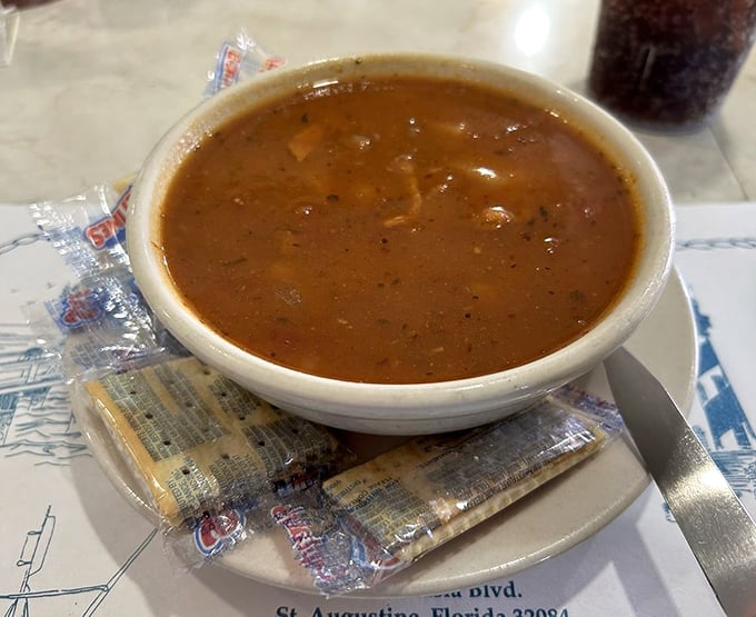 Minorcan clam chowder—where tomato and datil peppers create a spicy seafood symphony that's uniquely St. Augustine and universally delicious.