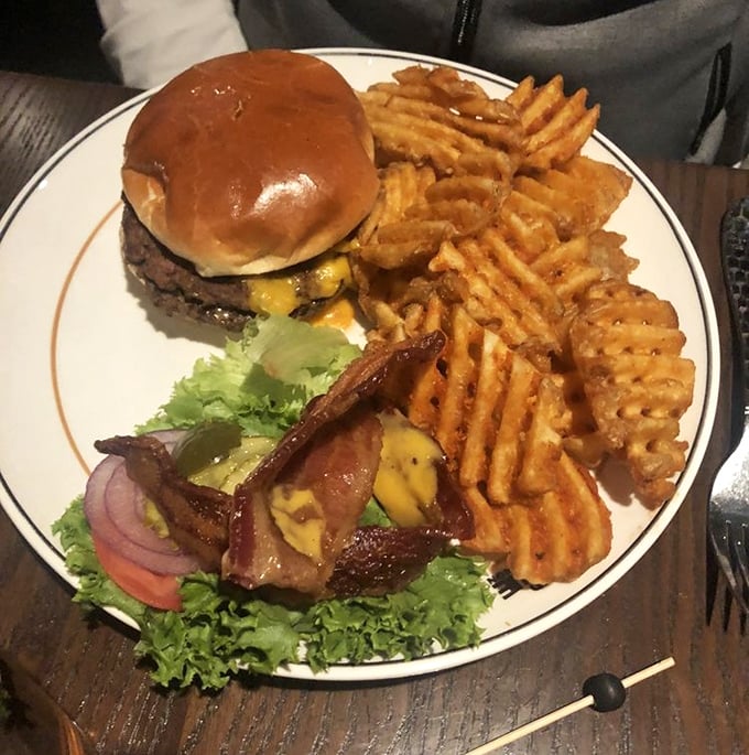 The Monon Burger – where beef meets destiny on a perfectly toasted bun. Those waffle fries deserve their own fan club and social media following.