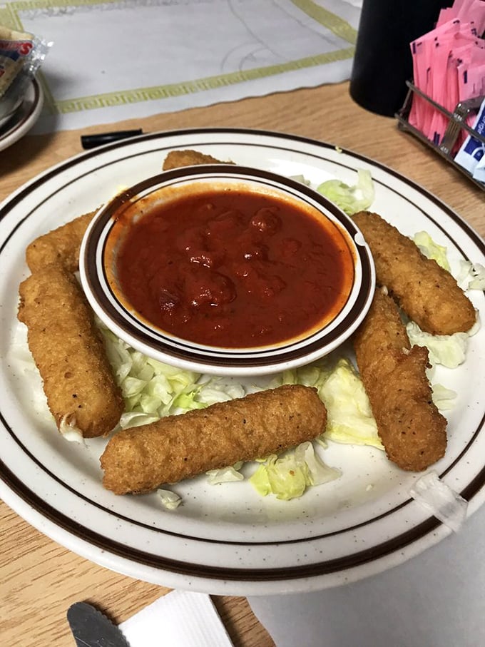 Mozzarella sticks—the universal language of appetizer happiness. Crispy outside, stretchy inside, and marinara for dunking—some pleasures never need upgrading.