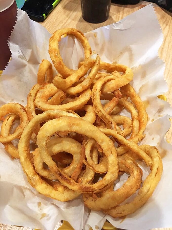 Onion rings done right—golden hoops of joy that crunch like autumn leaves but taste infinitely better.