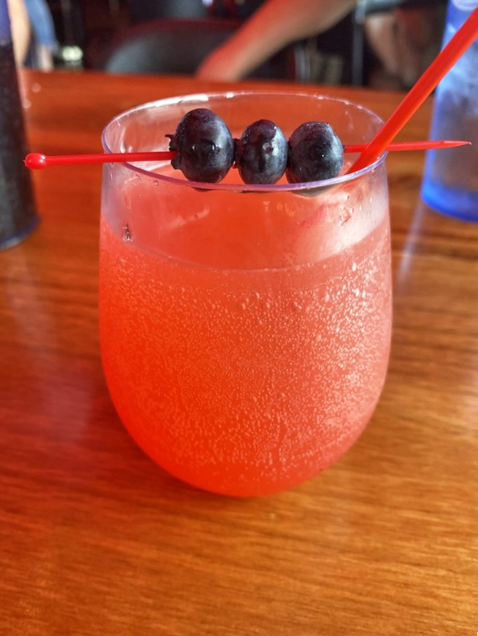 This isn't just a mimosa—it's sunrise in a glass with blueberry bodyguards standing watch. Brunch's perfect companion.