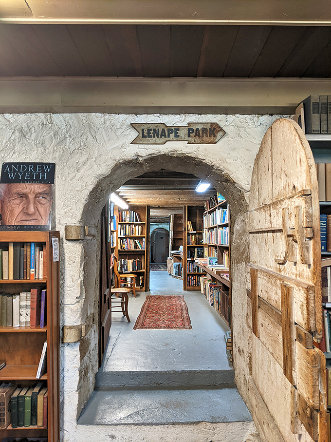 The "Lenape Park" archway isn't just a doorway—it's a portal between literary worlds, with that weathered wooden door guarding secrets from another era.