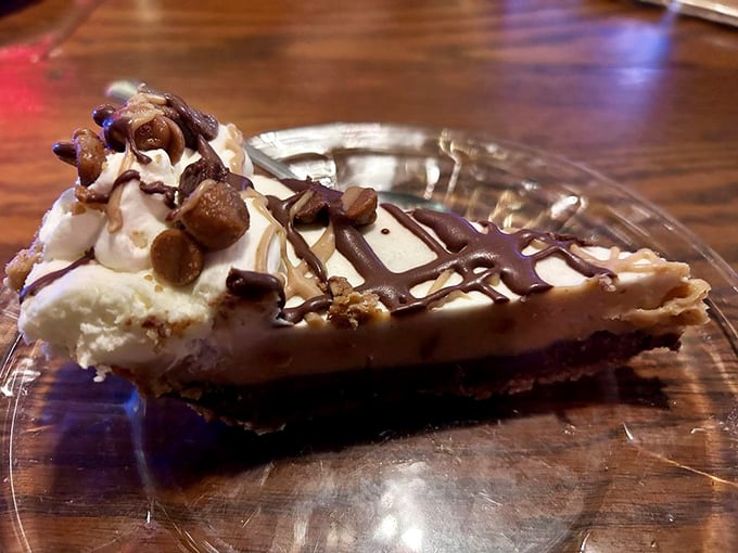 Peanut butter pie that makes you question why you've wasted time on lesser desserts. Those chocolate drizzles aren't just decoration—they're destiny.