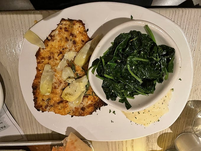 Pecan-crusted rainbow trout with sautéed spinach – proof that "healthy choice" and "absolutely delicious" aren't mutually exclusive concepts.