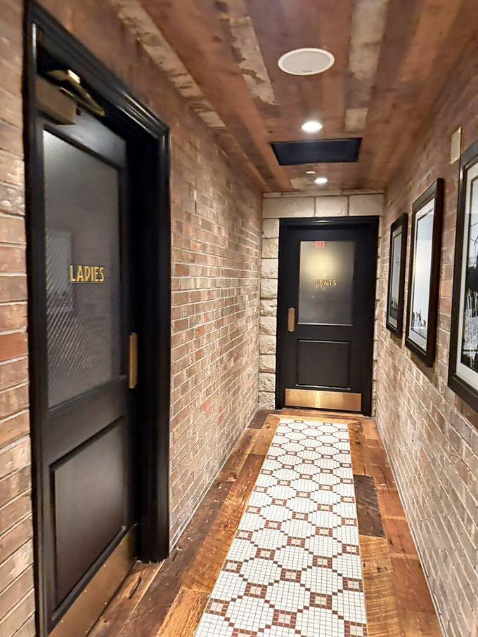 Even the hallway to the restrooms tells a story—brick walls and vintage touches that remind you this place has seen decades of satisfied diners.
