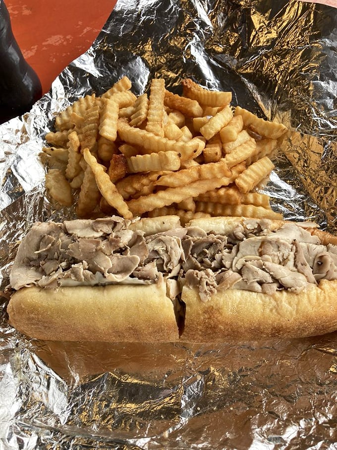 The classic combo that proves simplicity reigns supreme—a sandwich that needs nothing more than its perfect companion of crispy potatoes.