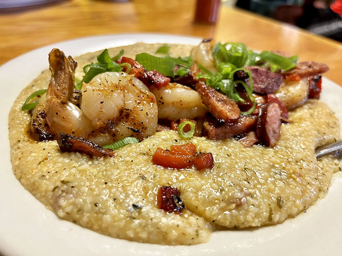 Shrimp and grits elevated to an art form – plump Gulf shrimp and smoky bacon nestled on creamy grits that would make any Southerner nod in approval.