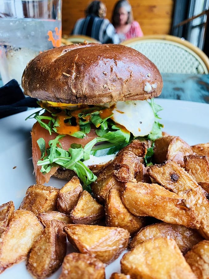 This burger isn't just food; it's architecture. A testament to the structural integrity of pretzel buns and the visual poetry of perfectly crisped potatoes.