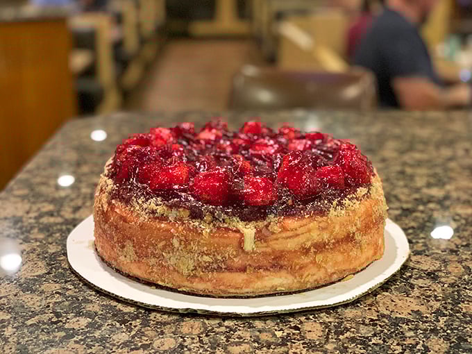 A strawberry cheesecake that doesn't need a filter. Those glistening berries are nature's jewelry atop a creamy canvas of indulgence.