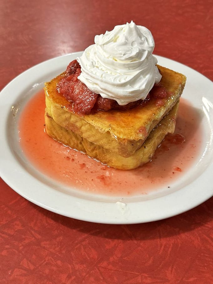 Stuffed French toast that doesn't just satisfy hunger—it creates memories. That whipped cream mountain isn't just for show.