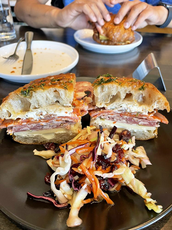 This sandwich isn't messing around—layers of Italian meats and cheeses with that slaw providing the perfect acidic counterpoint.