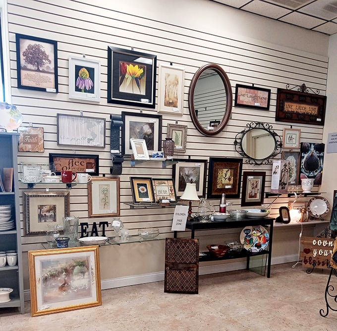 Wall art gallery that proves good taste doesn't require a gallery budget. That "EAT" sign speaks to my soul on multiple levels.