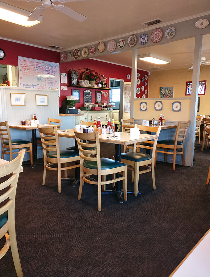 Wooden chairs invite conversation while decorative plates stand guard. This isn't just a dining room—it's where breakfast memories are made.