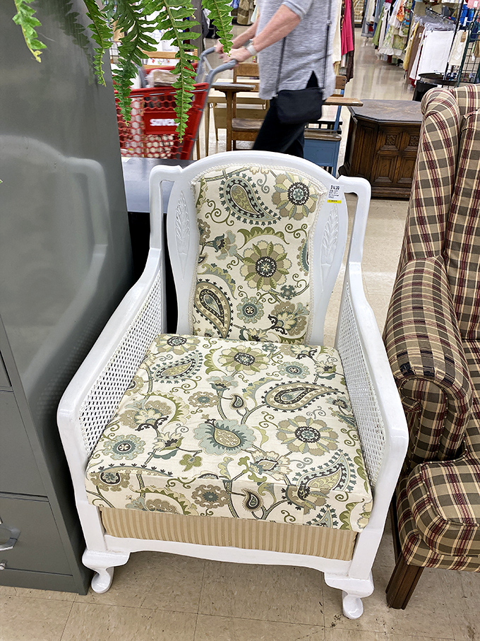 This white cane chair isn't just furniture—it's potential. With floral upholstery and vintage charm, it's begging for a spot in someone's reading nook.