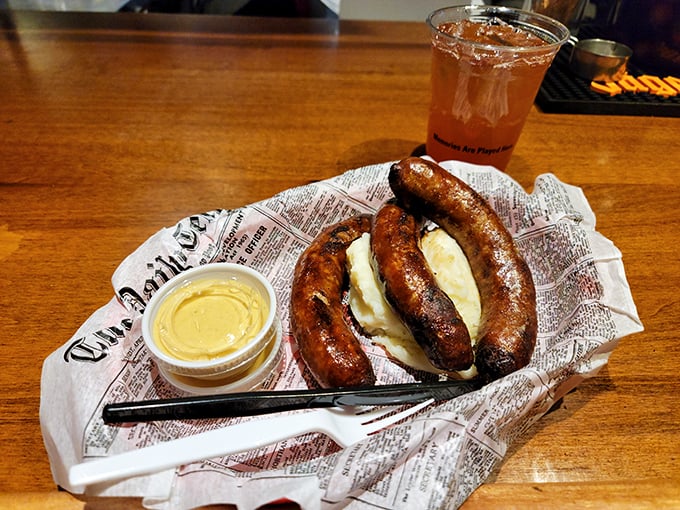 These bangers aren't just sausages—they're cylindrical flavor bombs nestled beside mashed potatoes, ready to transport you across the Atlantic.