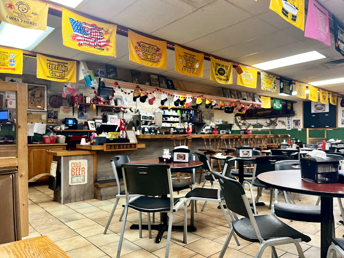 Yellow Terrible Towels hang proudly above tables where breakfast dreams come true. This diner's personality is as rich as its coffee.