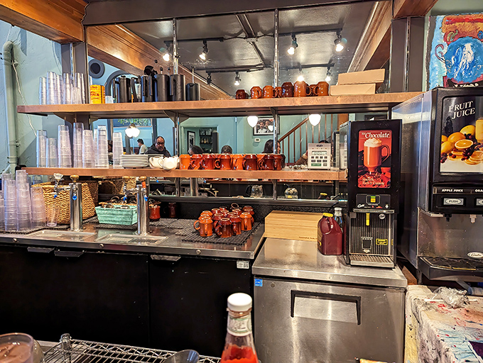 Where liquid happiness is born. Those brown mugs lined up like soldiers ready for coffee duty are about to make someone's morning infinitely better.