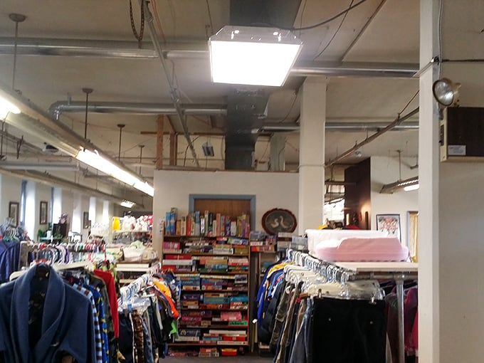 Books and games line the shelves, promising entertainment for pennies. That board game might contain all its pieces—a thrift store miracle!