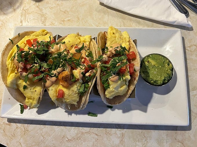 Breakfast tacos: where morning meets fiesta. That side of guacamole isn't just green—it's permission to start your day with joy.