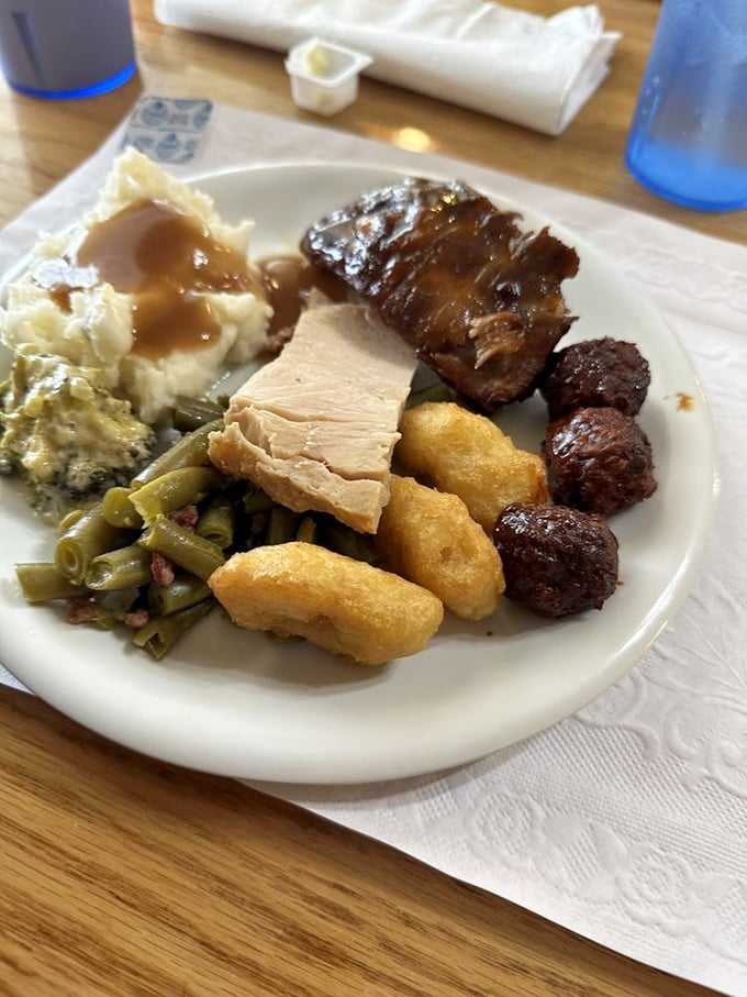 The buffet plate of champions – where green beans, mashed potatoes, and multiple proteins coexist in perfect harmony. This isn't a meal; it's an achievement.