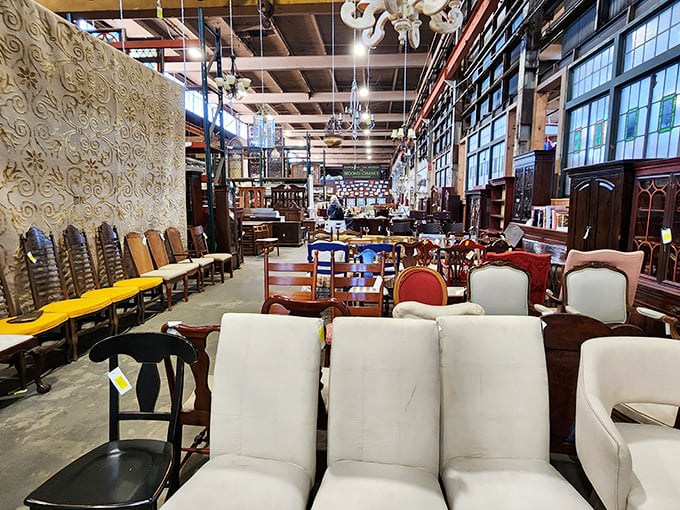 A symphony of seating styles—from formal dining chairs to plush armchairs—creates a waiting room where no one would mind waiting forever.