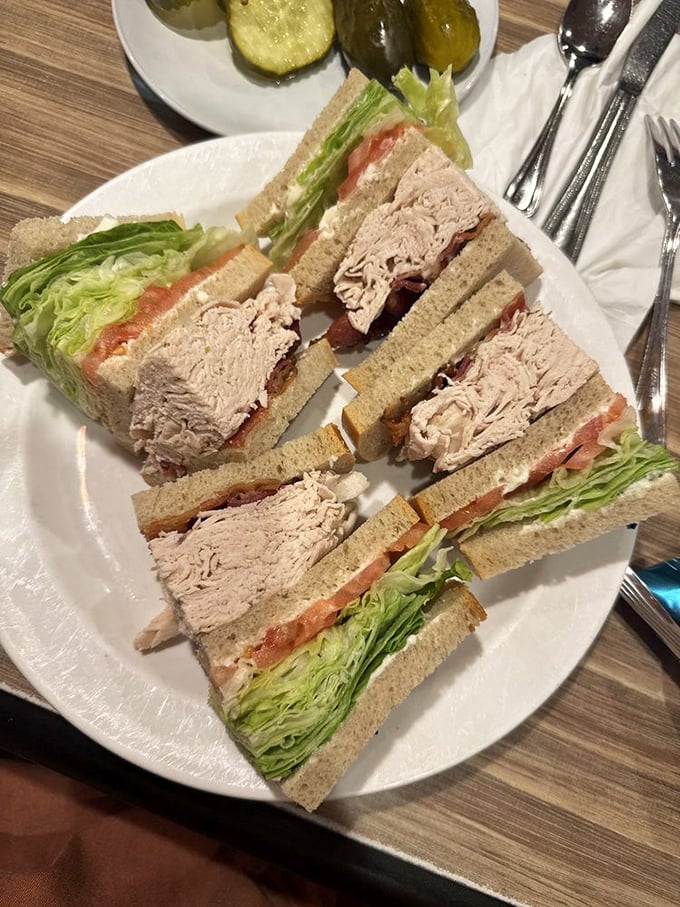 The club sandwich: architectural marvel of the deli world. Layers of turkey, bacon, and fresh lettuce create the skyscraper of sandwiches.