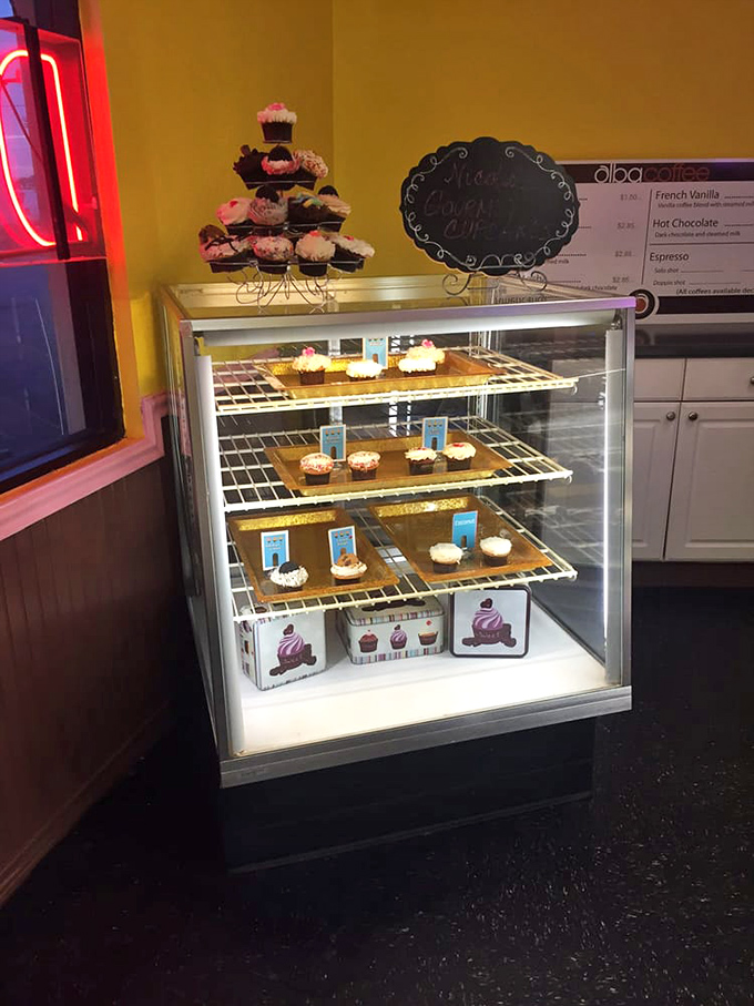 The cupcake display case: where frosting dreams come to life. Even adults need a little wonder behind glass sometimes.