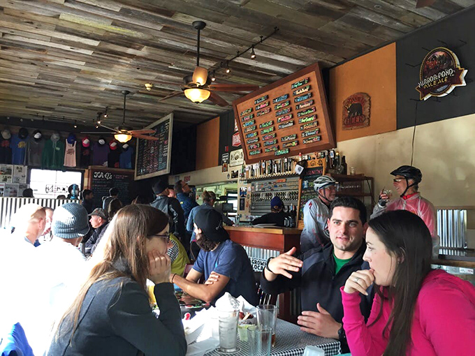 The universal language of barbecue brings strangers together at communal tables. Notice the absence of conversation—everyone's too busy eating.