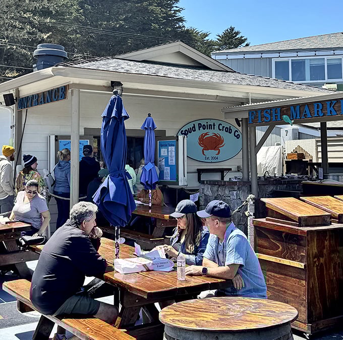 The outdoor dining experience at Spud Point – where picnic tables become thrones and every bite comes with a side of harbor views.