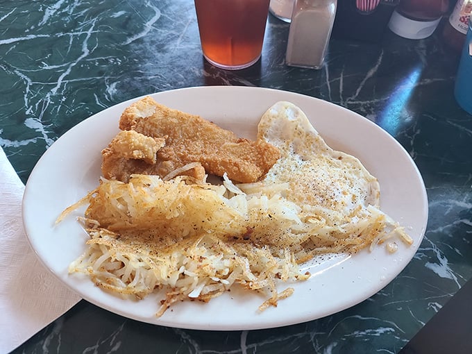 Golden-fried fish that crackles with each bite, alongside hash browns that somehow manage to be both crispy and tender. Magic exists!