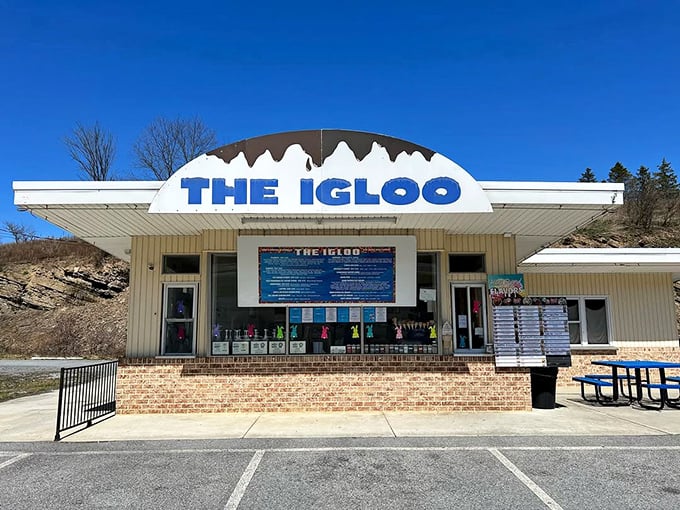 The Igloo's façade gleams in Pennsylvania sunshine, a temple of frozen delights where pilgrims gather to worship at the altar of soft serve.