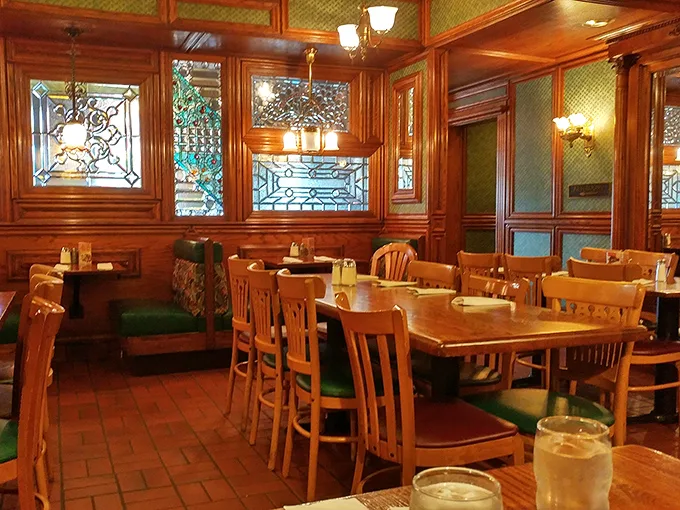 The dining room feels like breakfast's answer to a vintage library—warm wood, stained glass, and the promise of stories shared over coffee.