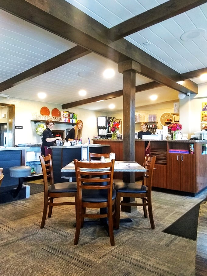 The counter service area—where regulars exchange news, servers multitask with ballet-like precision, and coffee flows like conversation.