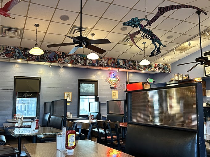 The whimsical ceiling decor includes what appears to be a dinosaur skeleton—because nothing says "fun dining experience" like extinct reptiles watching you eat.
