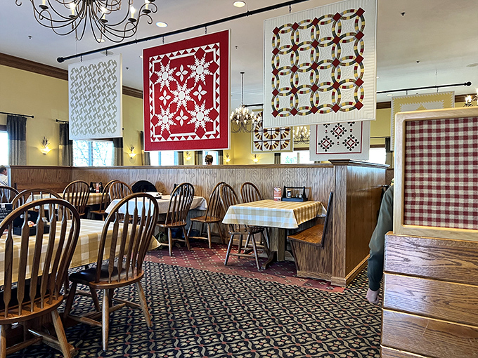 Quilts aren't just wall decorations here – they're textile storytellers hanging above Windsor chairs that have supported generations of satisfied diners.
