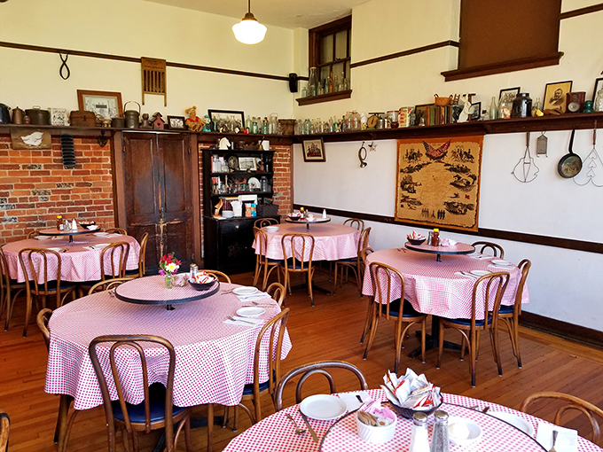 High ceilings, brick accents, and those classic bentwood chairs—this isn't just a dining room, it's a time machine with table service.