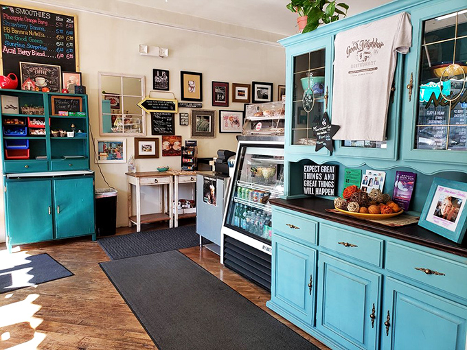 Turquoise cabinets and framed memories create a space that feels more like your favorite aunt's kitchen than a commercial restaurant.