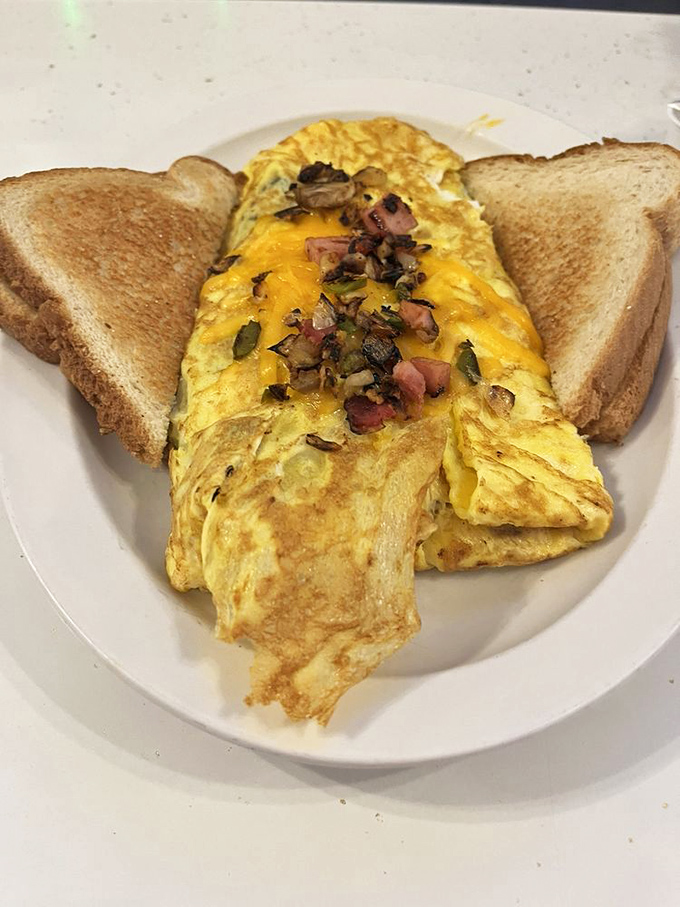 This isn't just an omelet – it's a carefully crafted envelope of eggs delivering a personal letter of ham, cheese and vegetables to your taste buds.