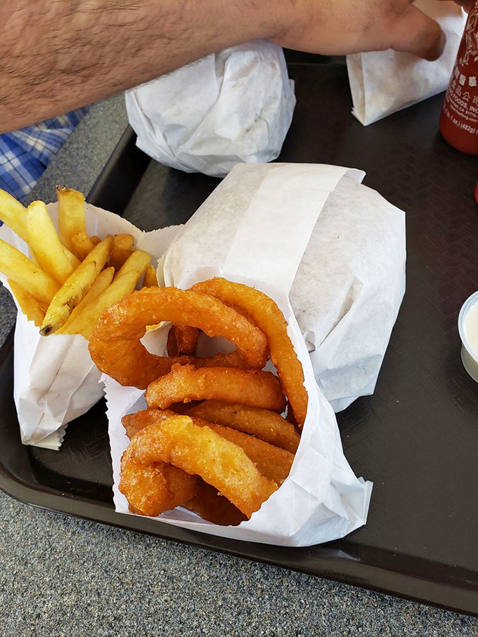 Onion rings with the perfect crunch-to-softness ratio – the kind that make you wonder why you ever waste calories on lesser versions.