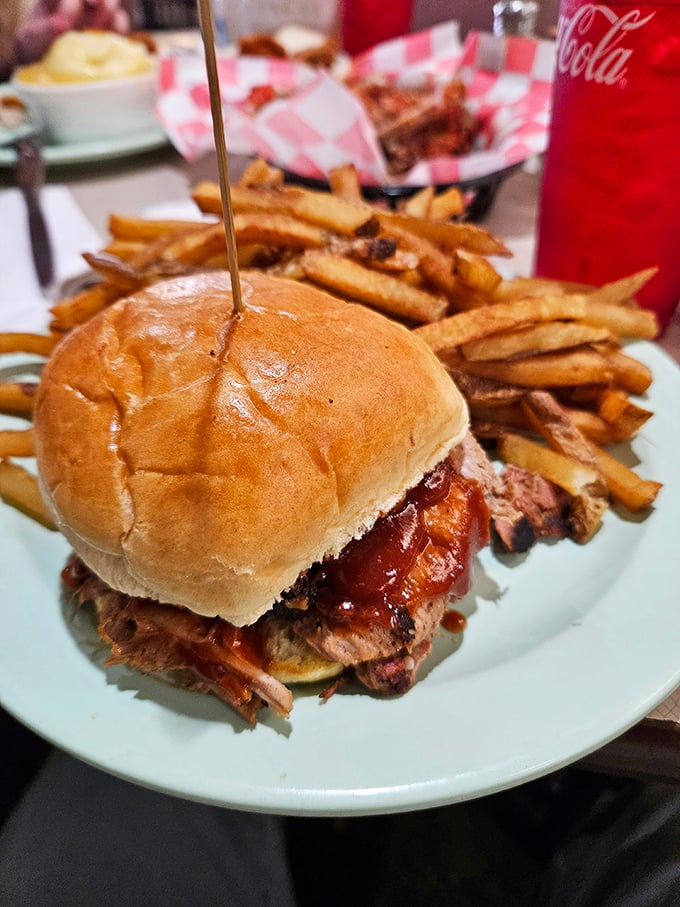 This isn't just a sandwich—it's an engineering marvel. Tender pulled pork piled high with just enough sauce to enhance without drowning the meat.