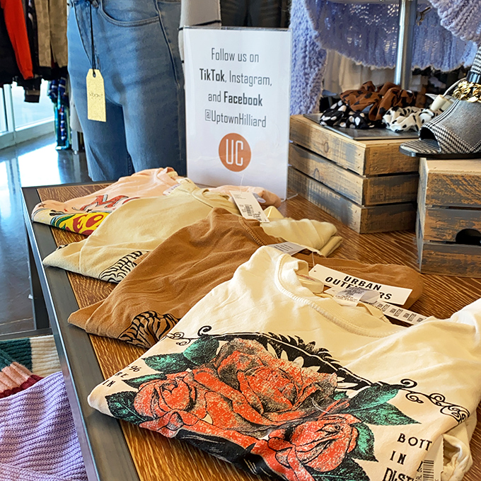 Graphic tees and casual tops with original tags still attached—the holy grail of secondhand shopping. That floral design is practically singing "Buy me!"