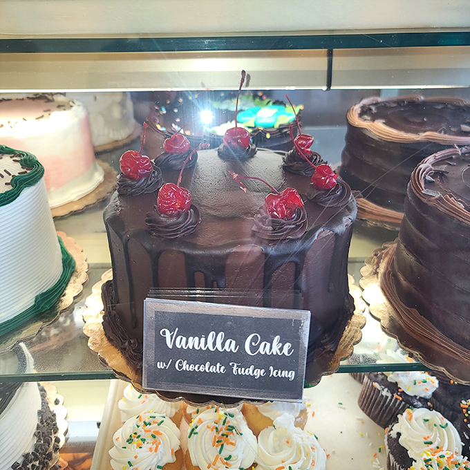A chocolate cake crowned with cherries that doesn't just whisper "special occasion"—it announces it with a megaphone. 